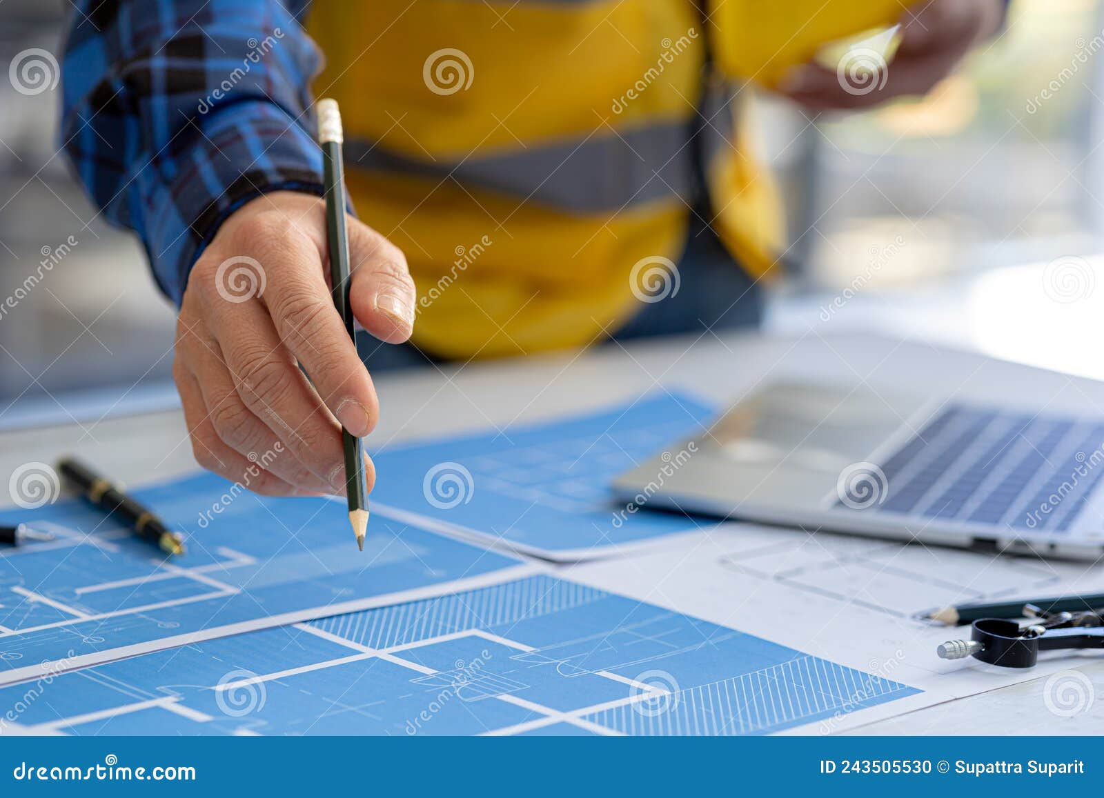 Architect Pointing To Building Plans for Review and Editing, Architect ...