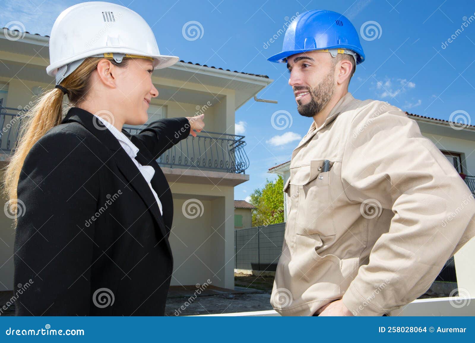 Architect Pointing To Construction Building Plan To Builder Stock Photo ...