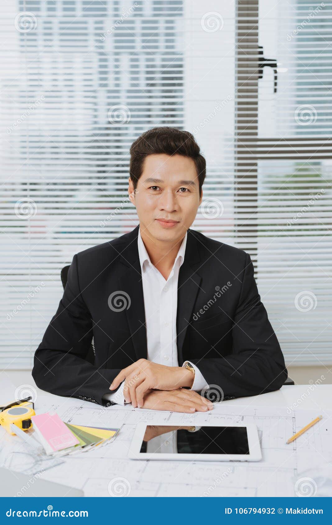 Architect - Project Manager Working with Blueprints in the Office Stock ...