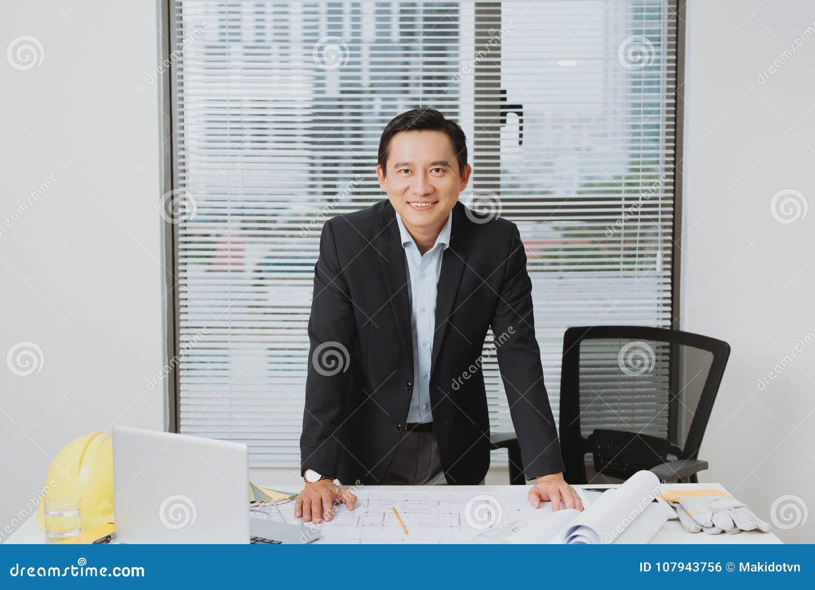 Architect - Project Manager Working with Blueprints in the Office Stock ...