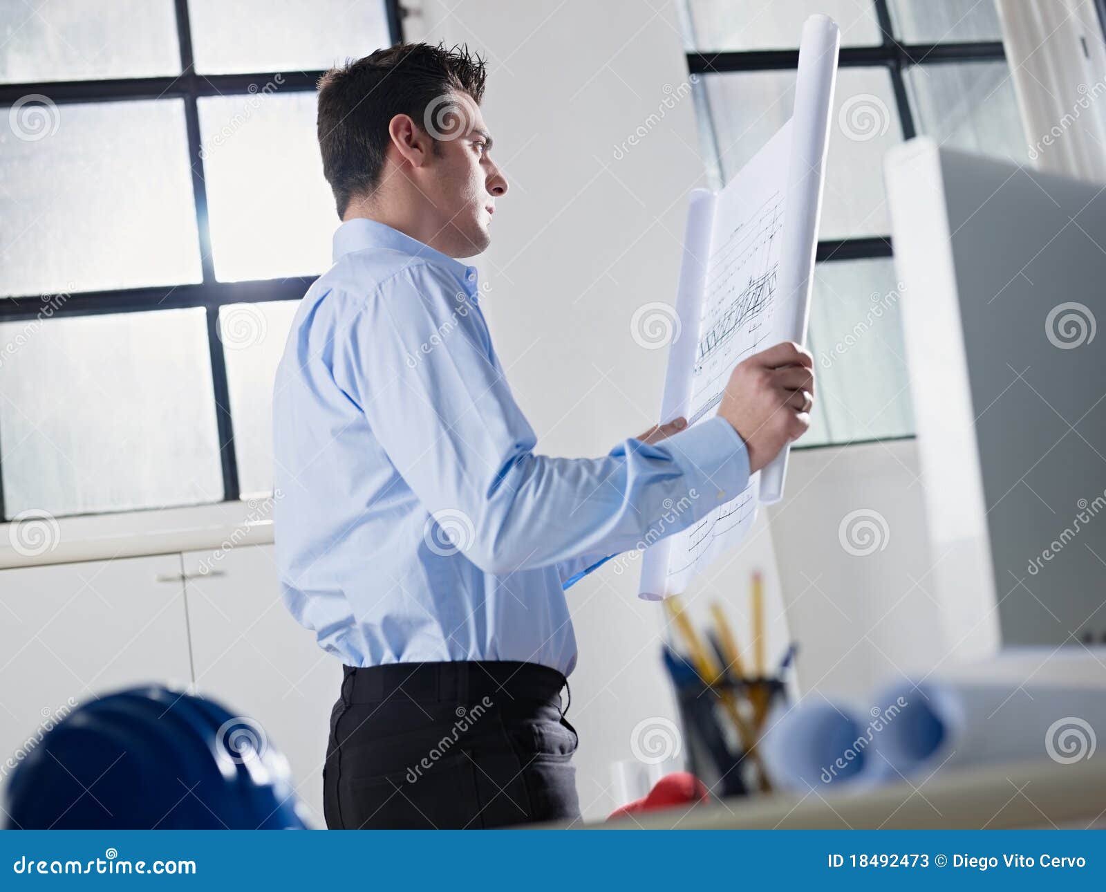Architect Reading Blueprint in Office Stock Image - Image of looking ...