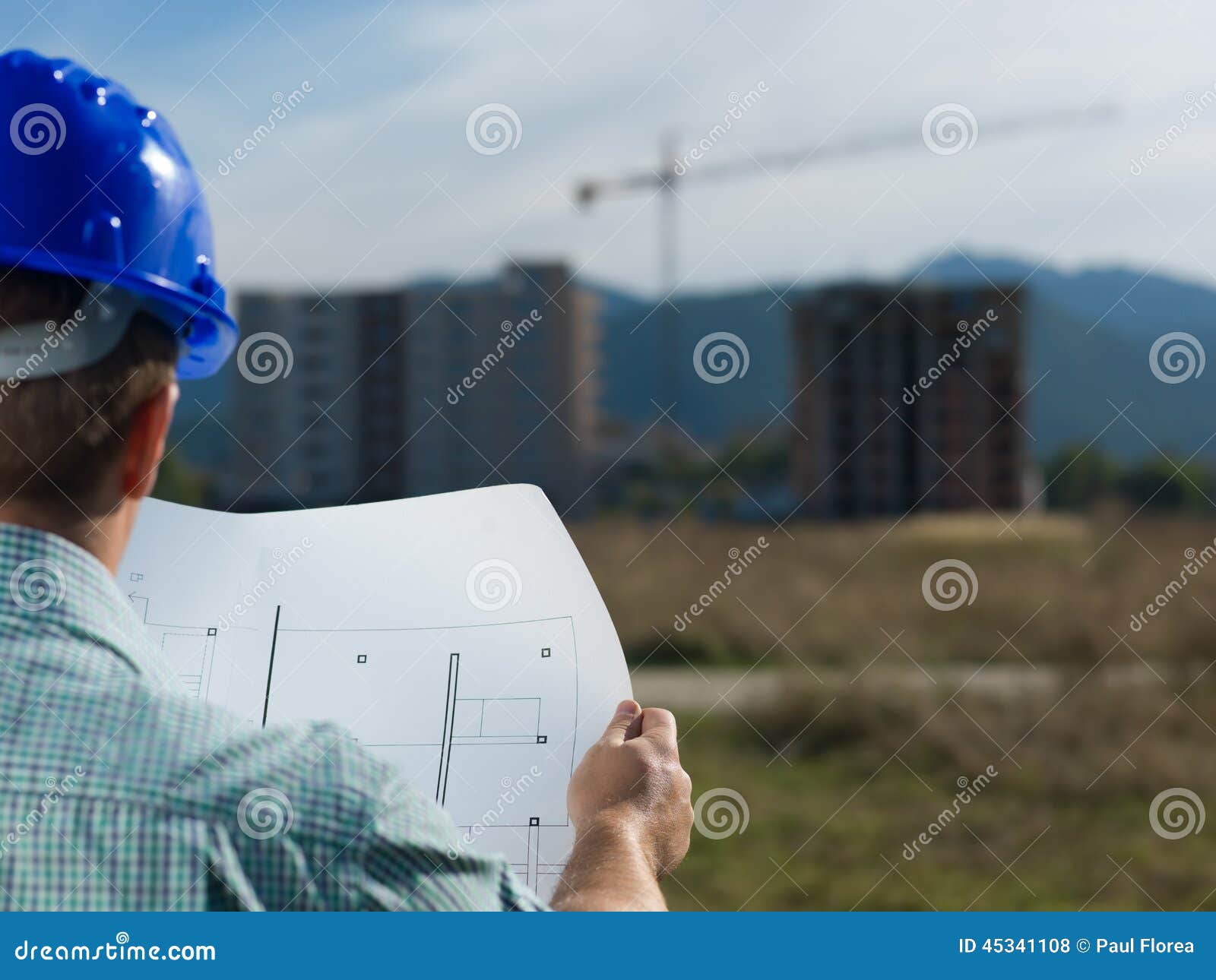 Architect Reading Technical Drawing of Construction Stock Photo - Image ...