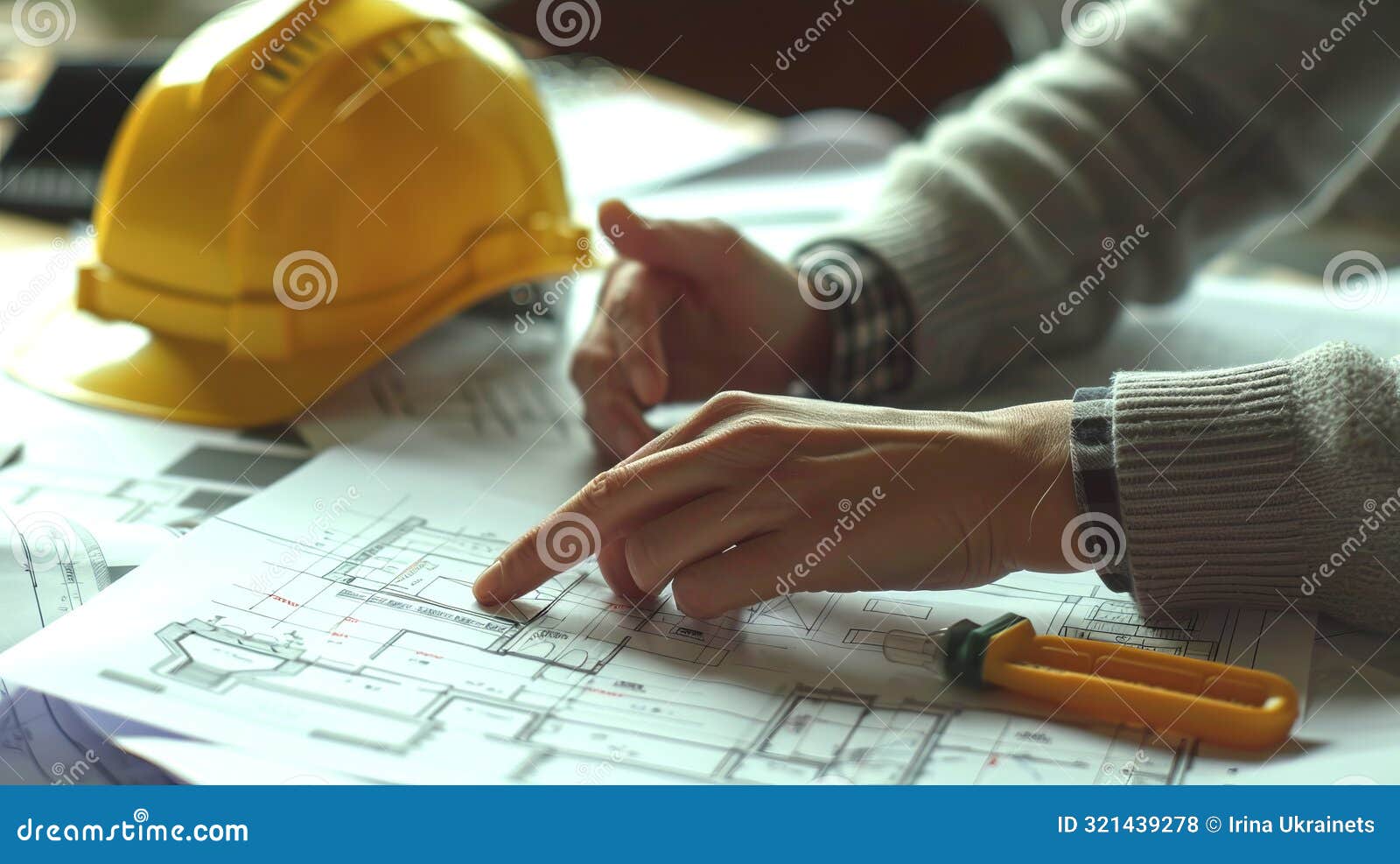 Architect Reviewing Blueprint Plans at Desk. Engineering Workspace with ...