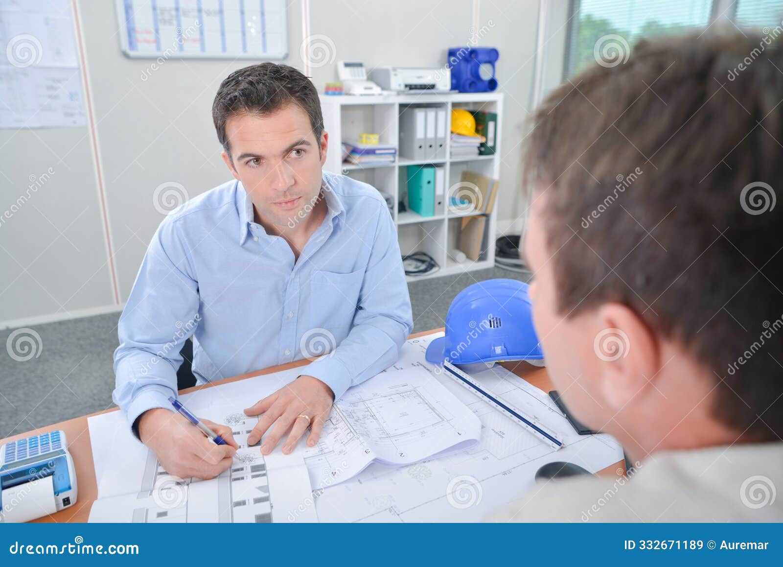 Architect Running through Plans with Client Stock Image - Image of ...