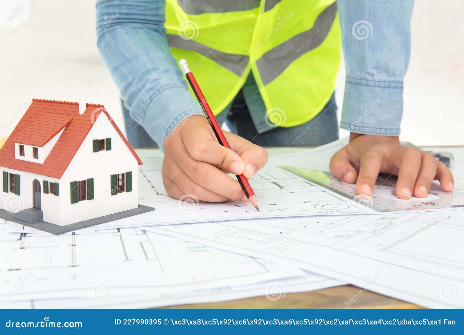 The Architect is Seriously Revising the Drawings on the Table Stock ...