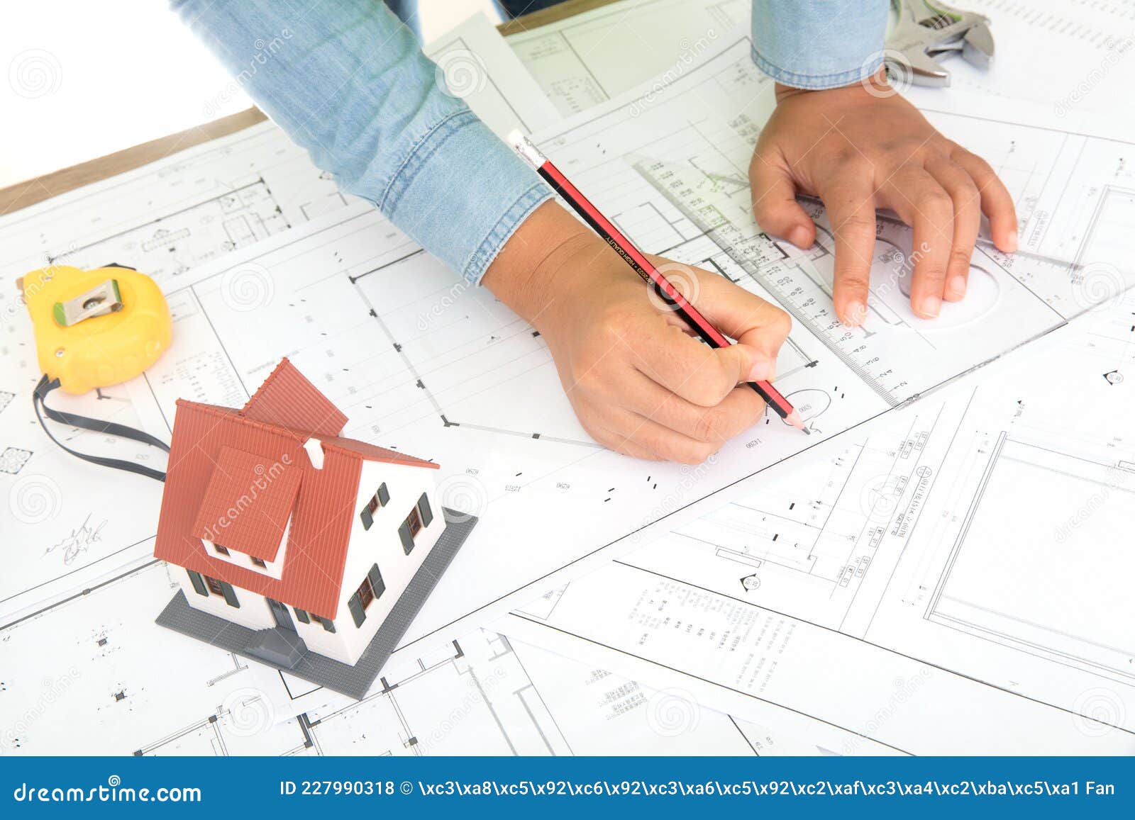 The Architect is Seriously Revising the Drawings on the Table Stock ...