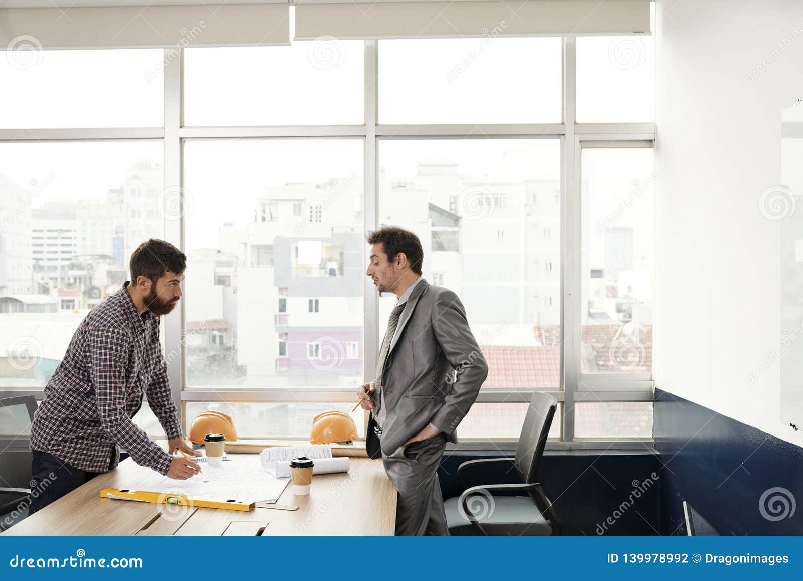 Architect Showing Blueprint To Head Engineer Stock Photo - Image of ...