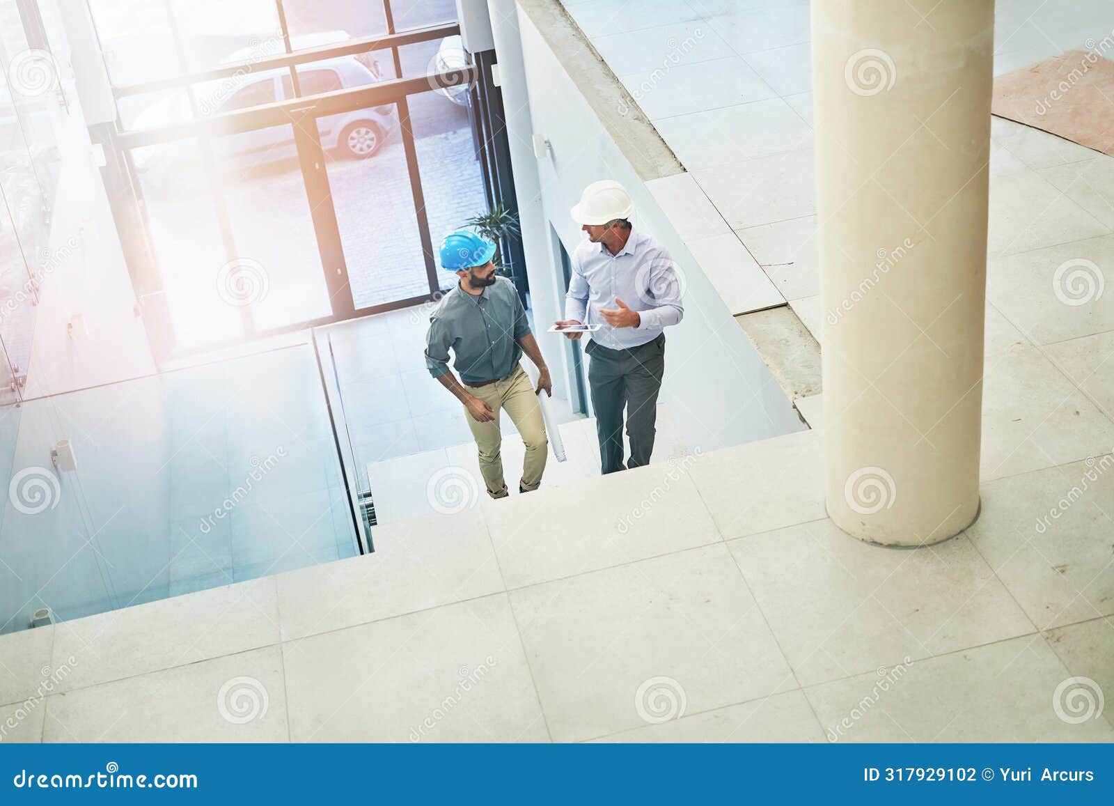 Architect, Speaking and Businessman with Hardhat in Office, Workplace ...