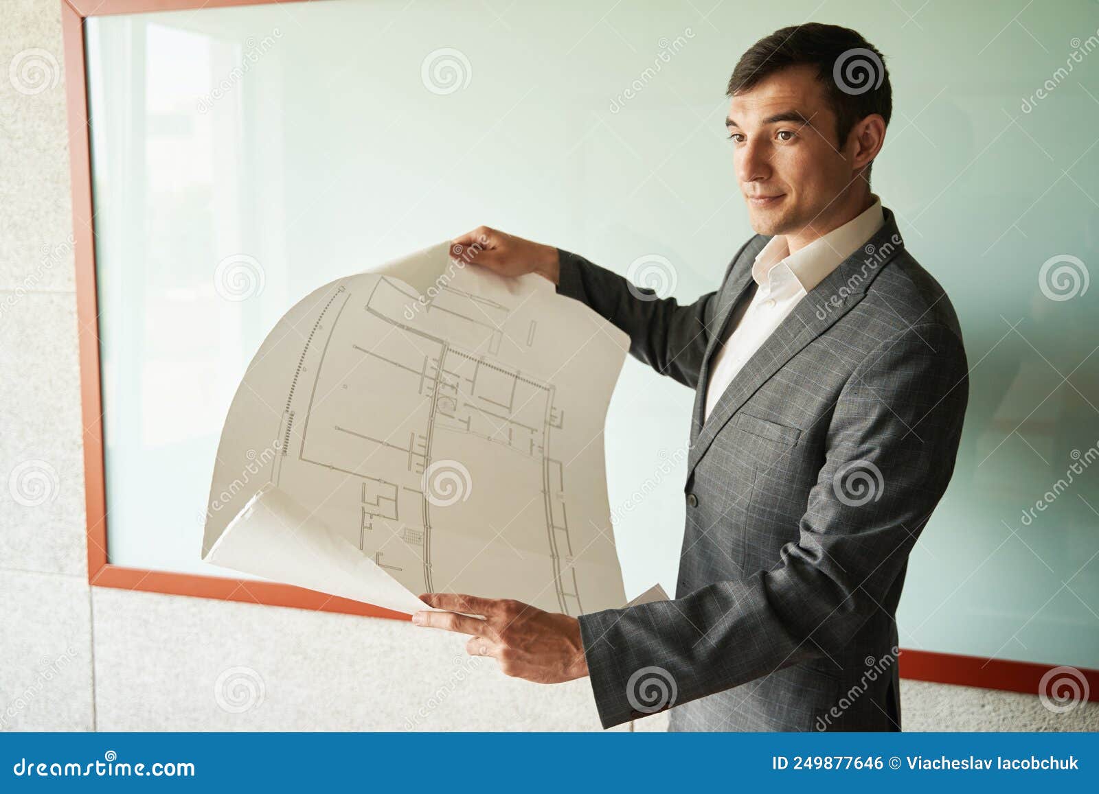Architect Spreading Out Drawings in His Hands Stock Photo - Image of ...