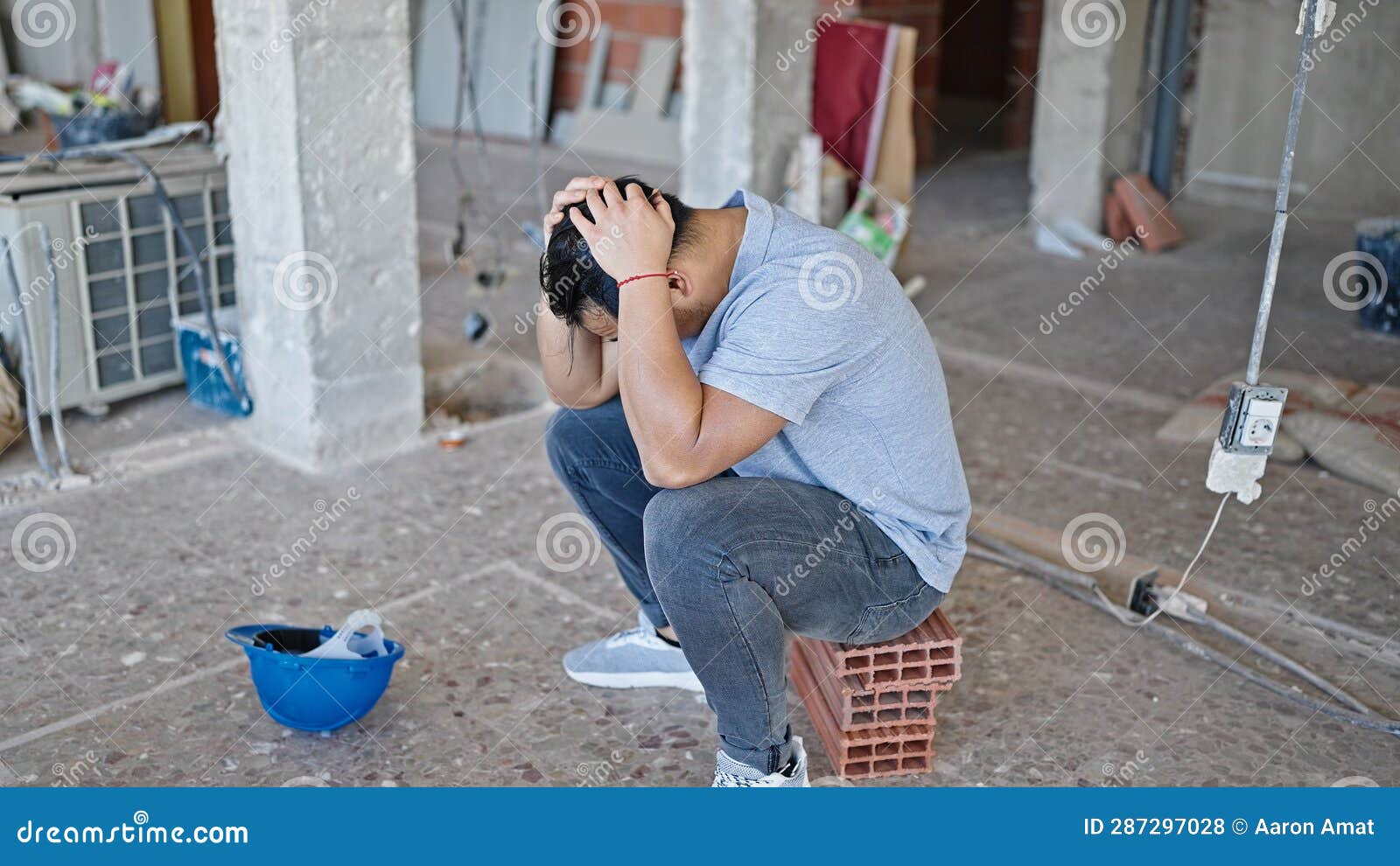 Architect Stressed Sitting on Floor at Construction Site Stock Photo ...