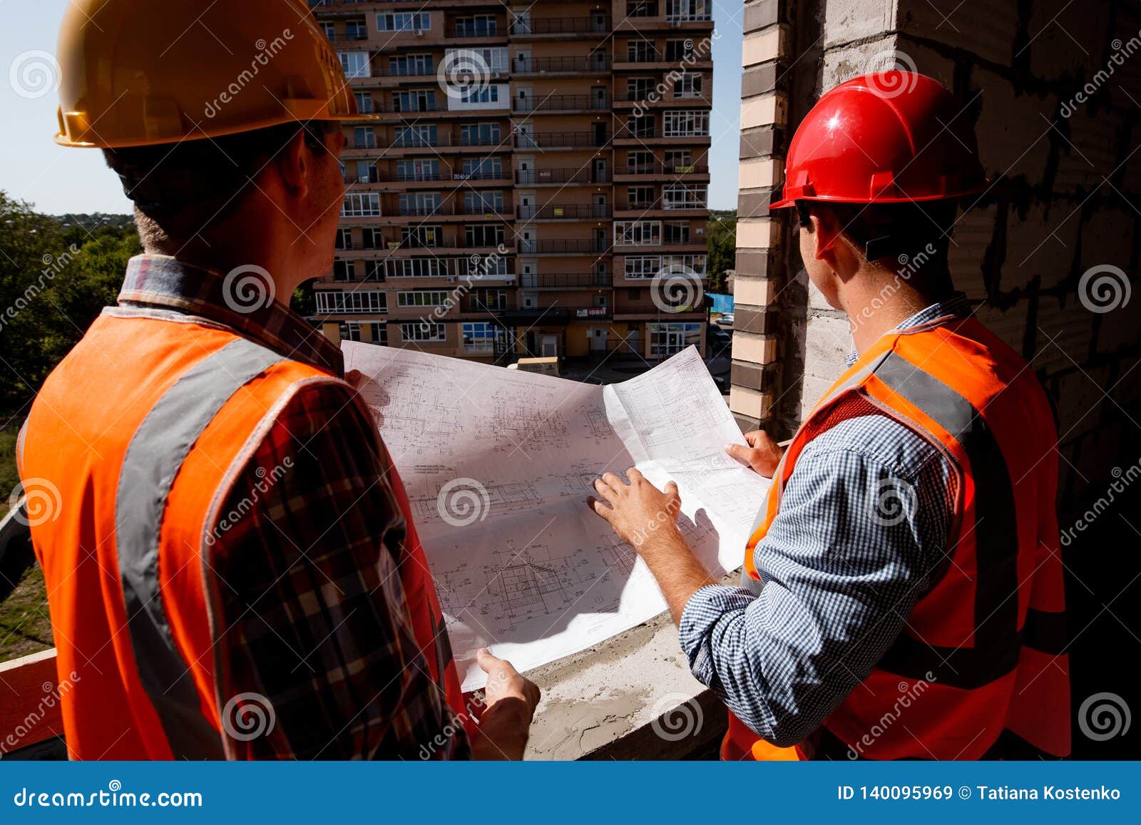 Architect and Structural Engineer Dressed in Shirts, Orange Work Vests ...