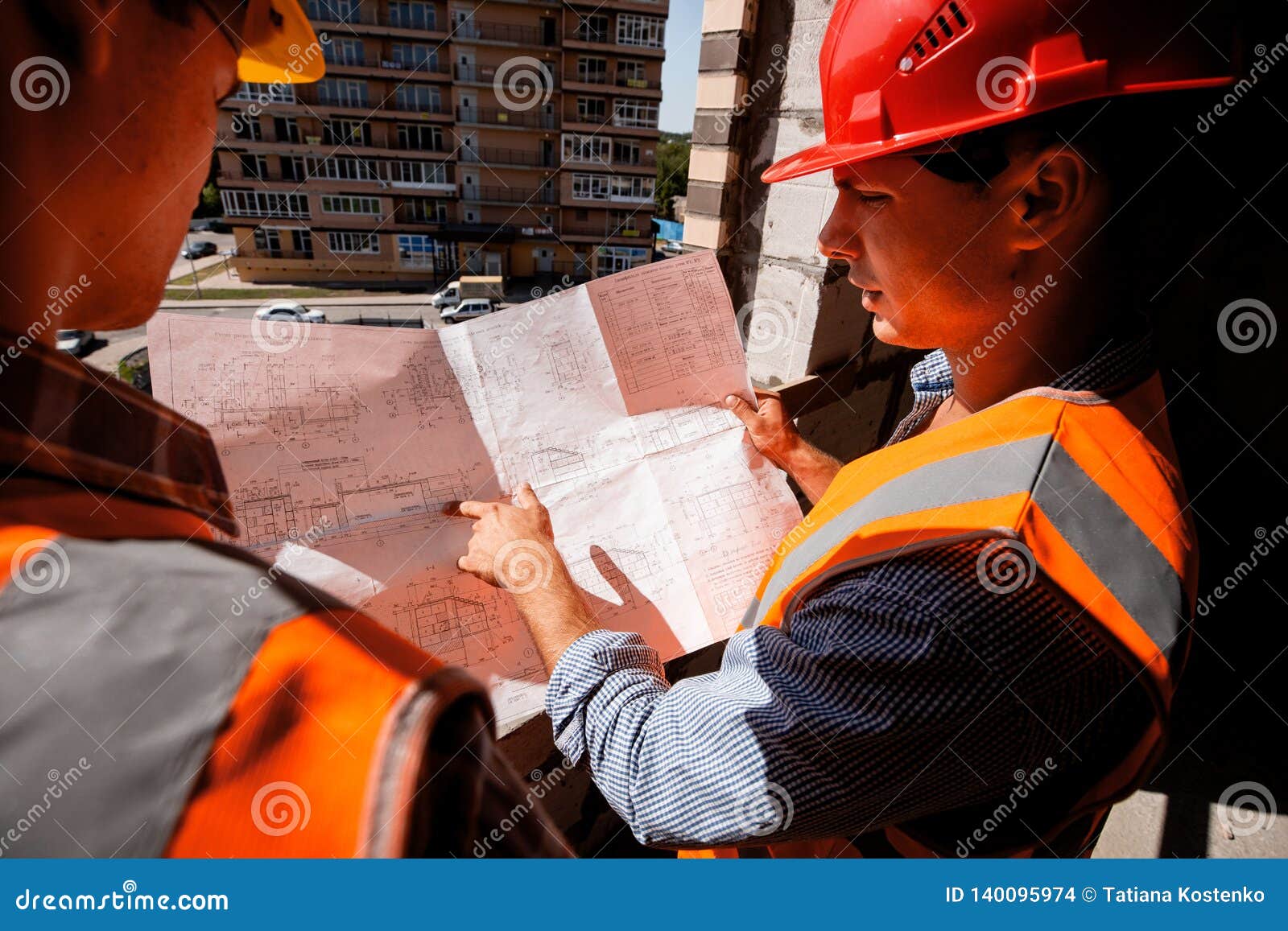 Architect and Structural Engineer Dressed in Shirts, Orange Work Vests ...