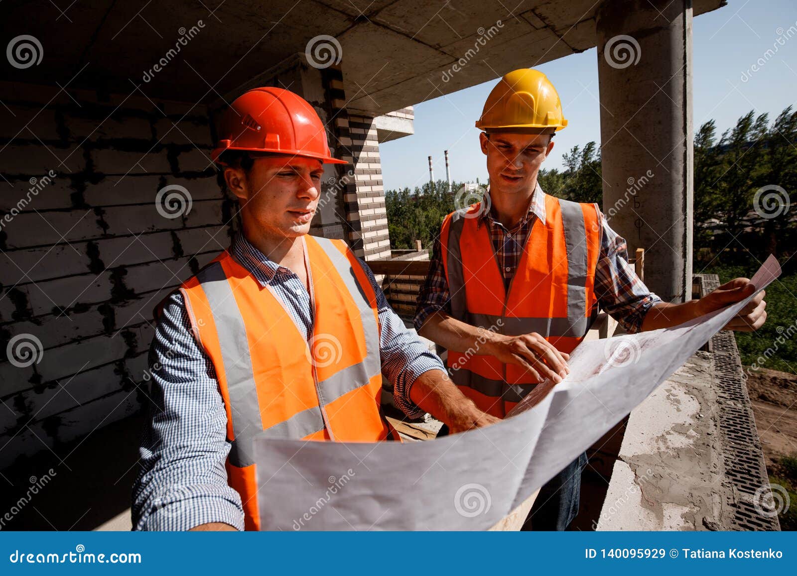 Architect and Structural Engineer Dressed in Shirts, Orange Work Vests ...