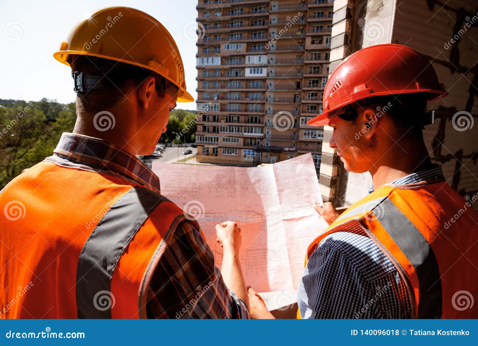 Architect and Structural Engineer Dressed in Shirts, Orange Work Vests ...