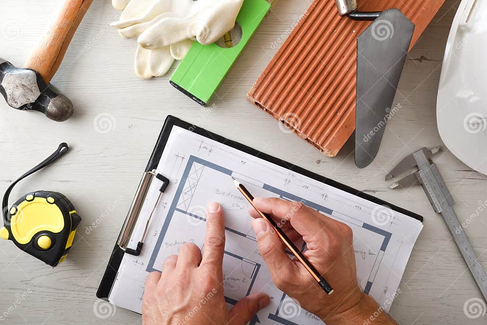 Architect Taking Notes on Table with Construction Materials and Tools ...