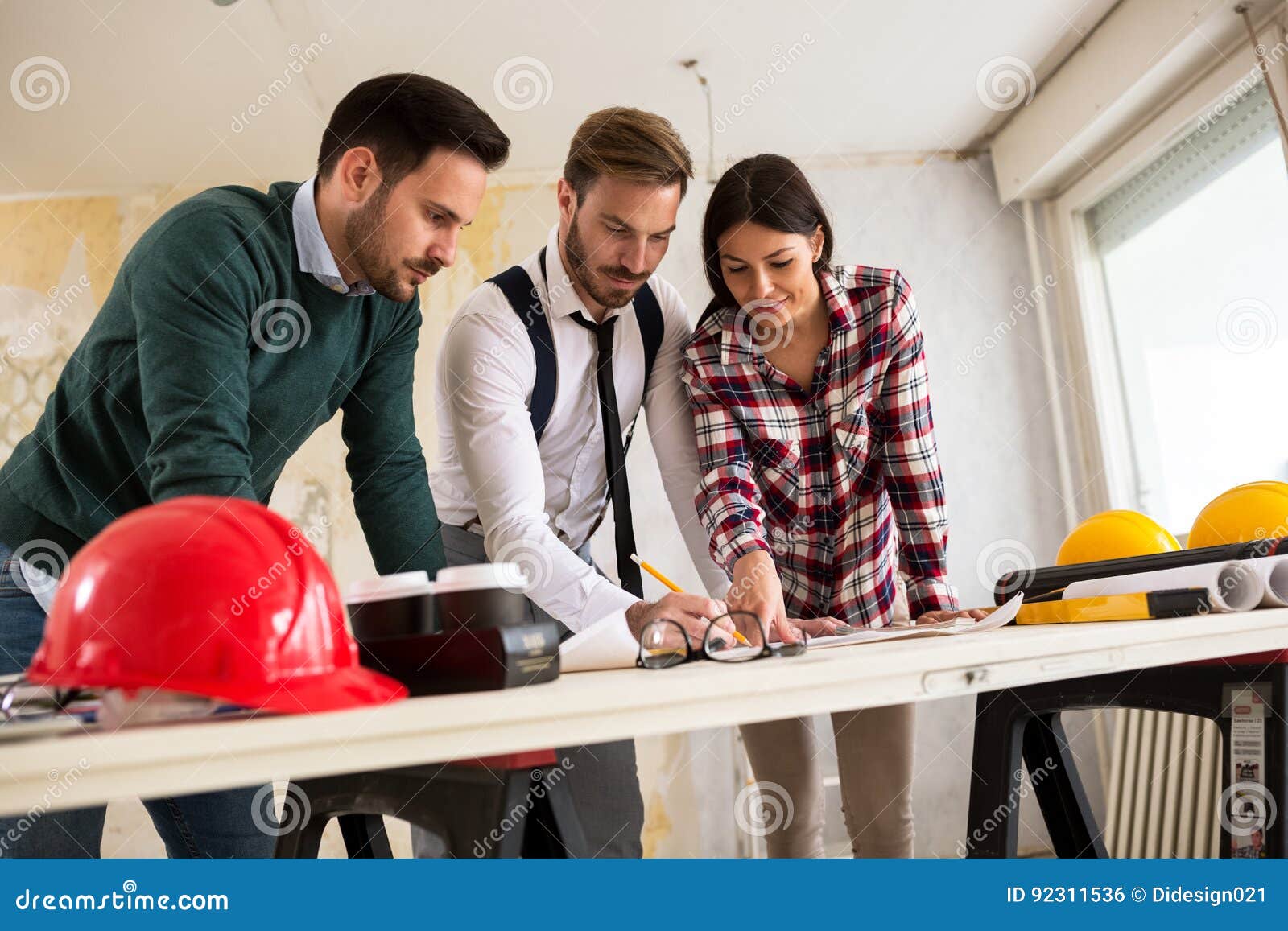 Architect Team Discussing about Blueprints Stock Photo - Image of group ...