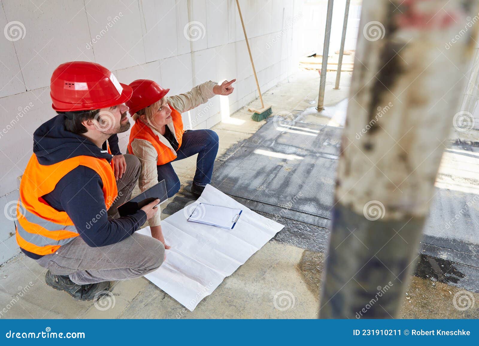 Architects Team with Floor Plan on the Construction Site Stock Image ...
