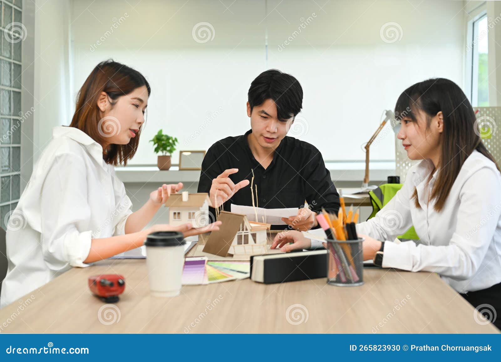 Architect Team Working Together on Design of a Construction Plan and ...