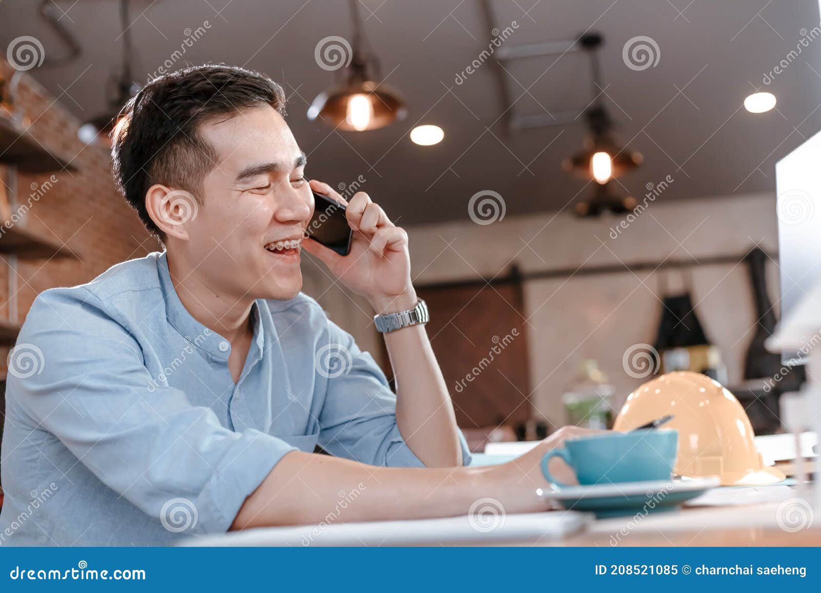 Architect Use Mobile Phone Call with Enginner and Reading a Building ...