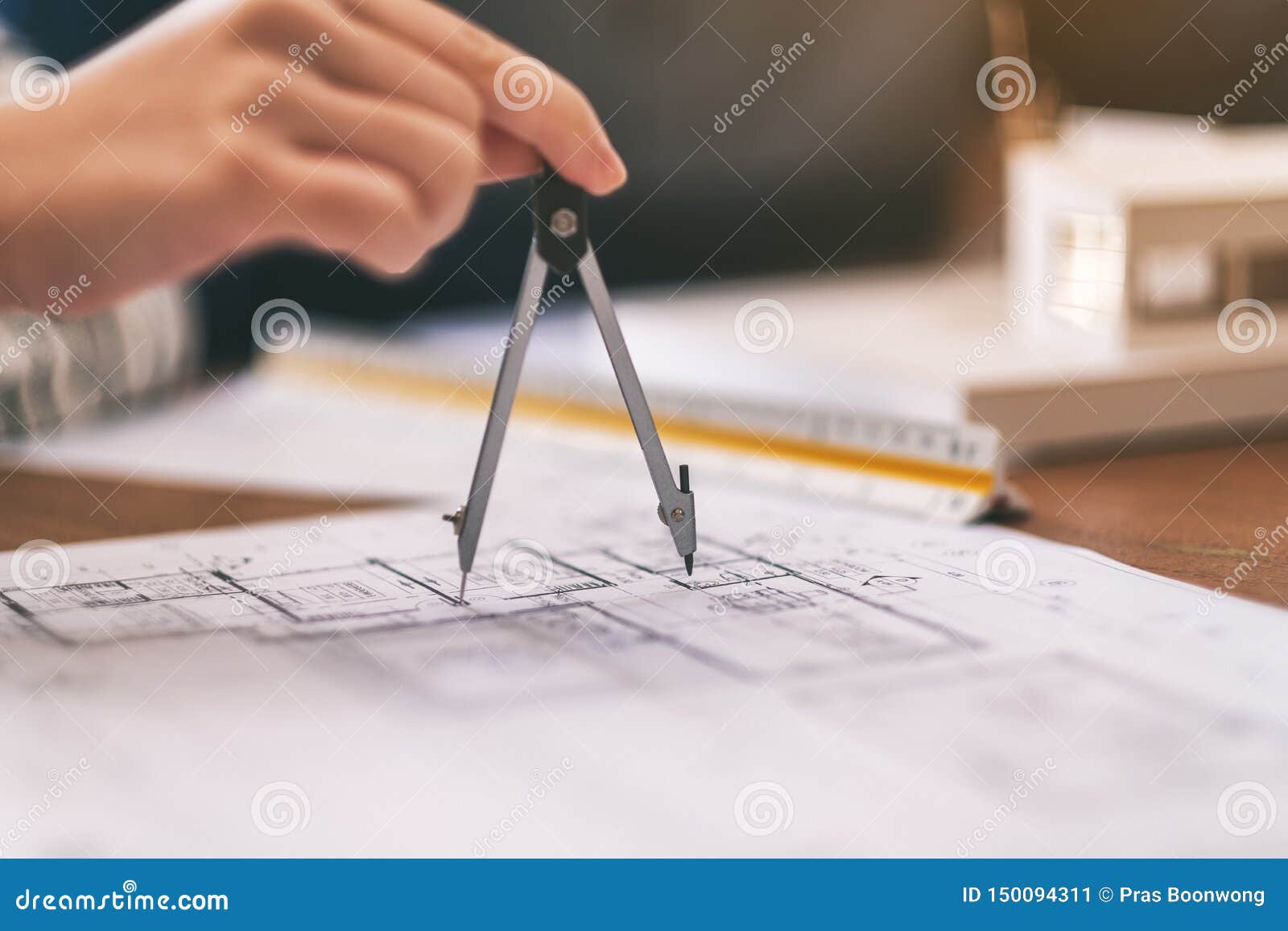An Architect Using Compass To Draw and Measure Shop Drawing Stock Image ...