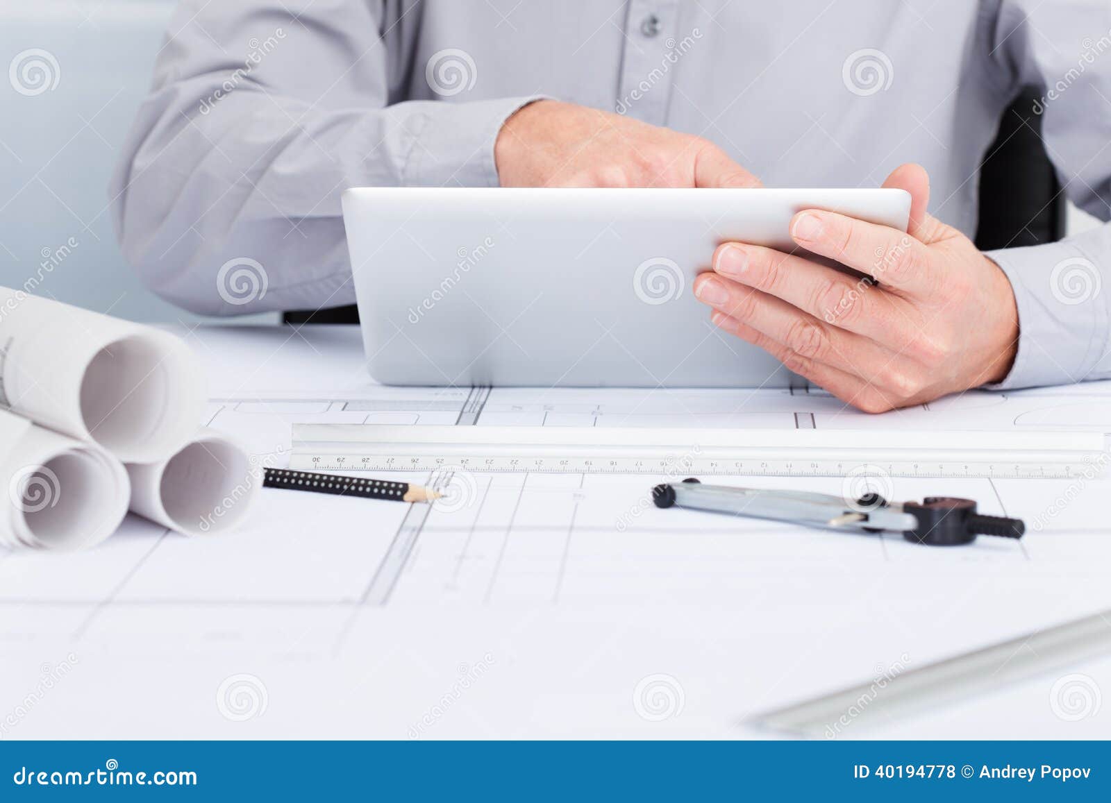 Draftsman Using T-square And Pencil For Drafting On The Graph Paper ...