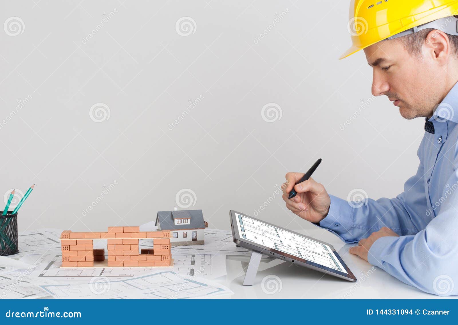 Architect Using Digital Tablet on Office Table Desk. Stock Photo ...