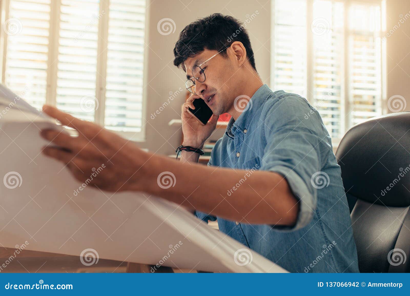 Architect Using Phone at His Workplace Stock Photo - Image of desk ...