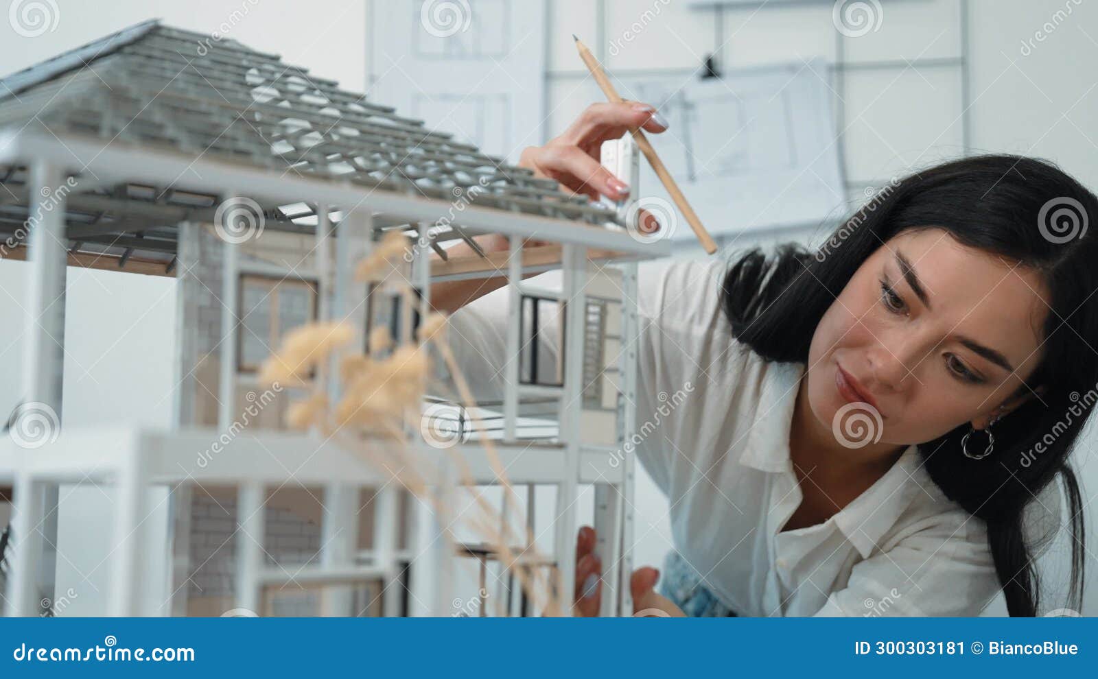 Architect Using Ruler To Measure House Model at Modern Office ...