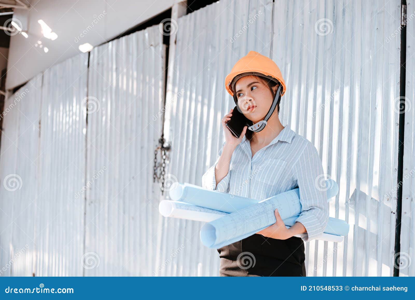 Architect Woman Use Mobile Phone Call with Enginner or Project Manager ...