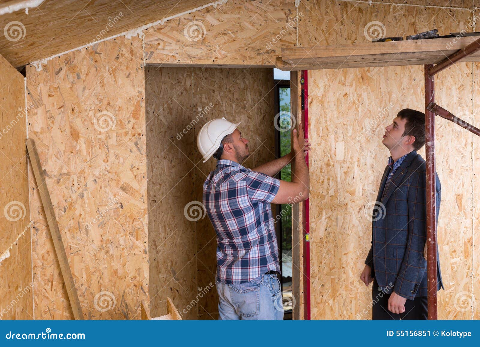 Architect and Worker Checking Levels on Door Frame Stock Image - Image ...