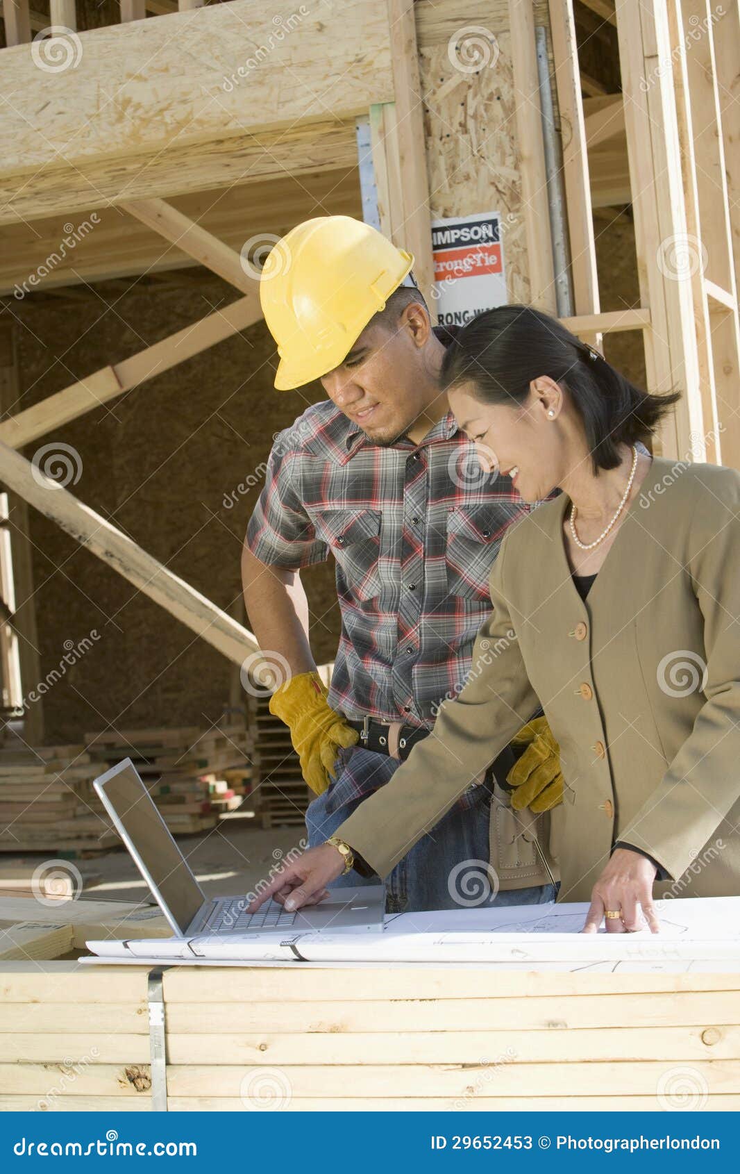 Architect and Worker Looking at Plan on Laptop Stock Image - Image of ... Architect and Worker Looking at Plan on Laptop Stock Image - Image of ...