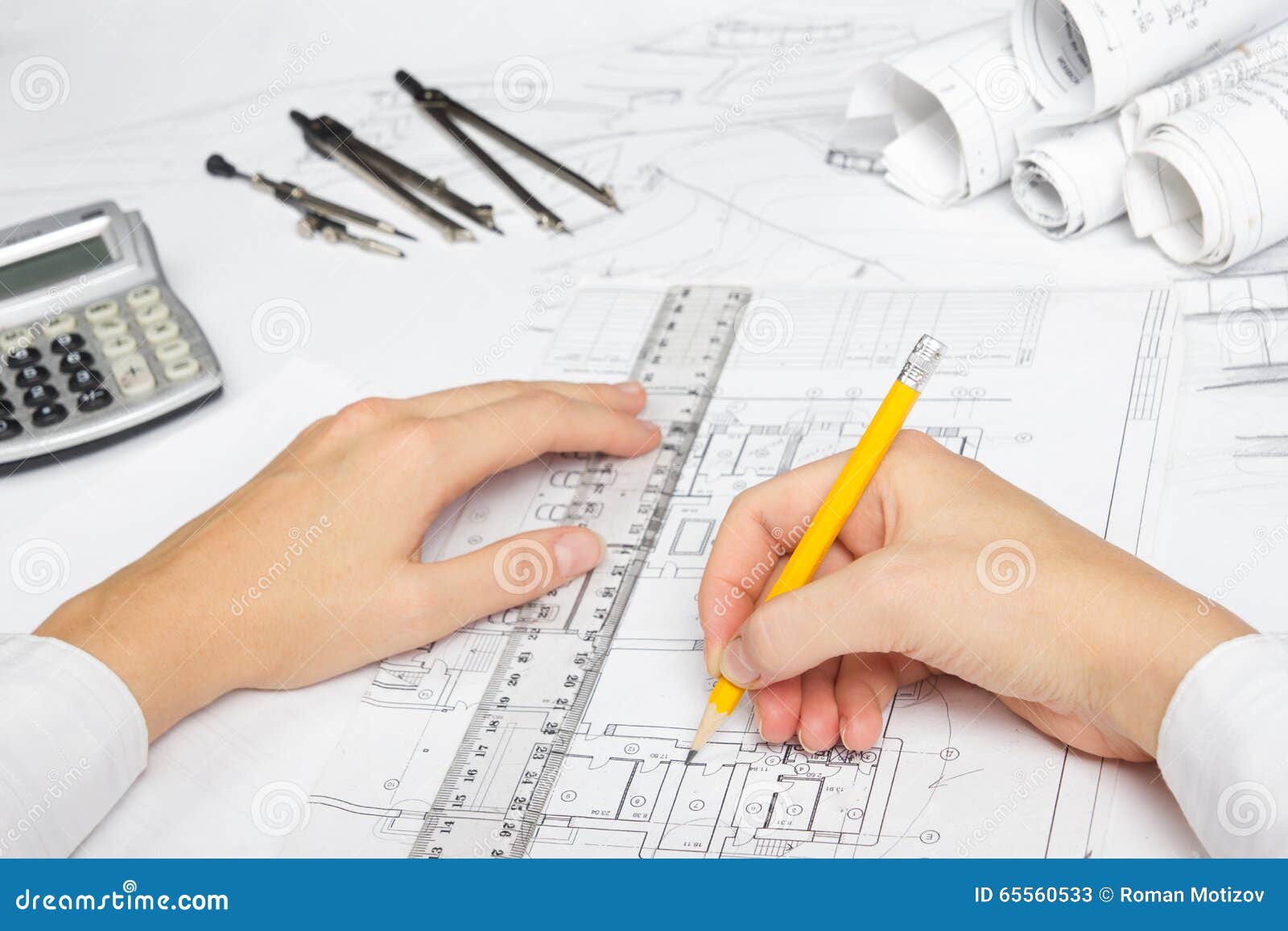 Architect Working on Blueprint. Architects Workplace - Architectural ...