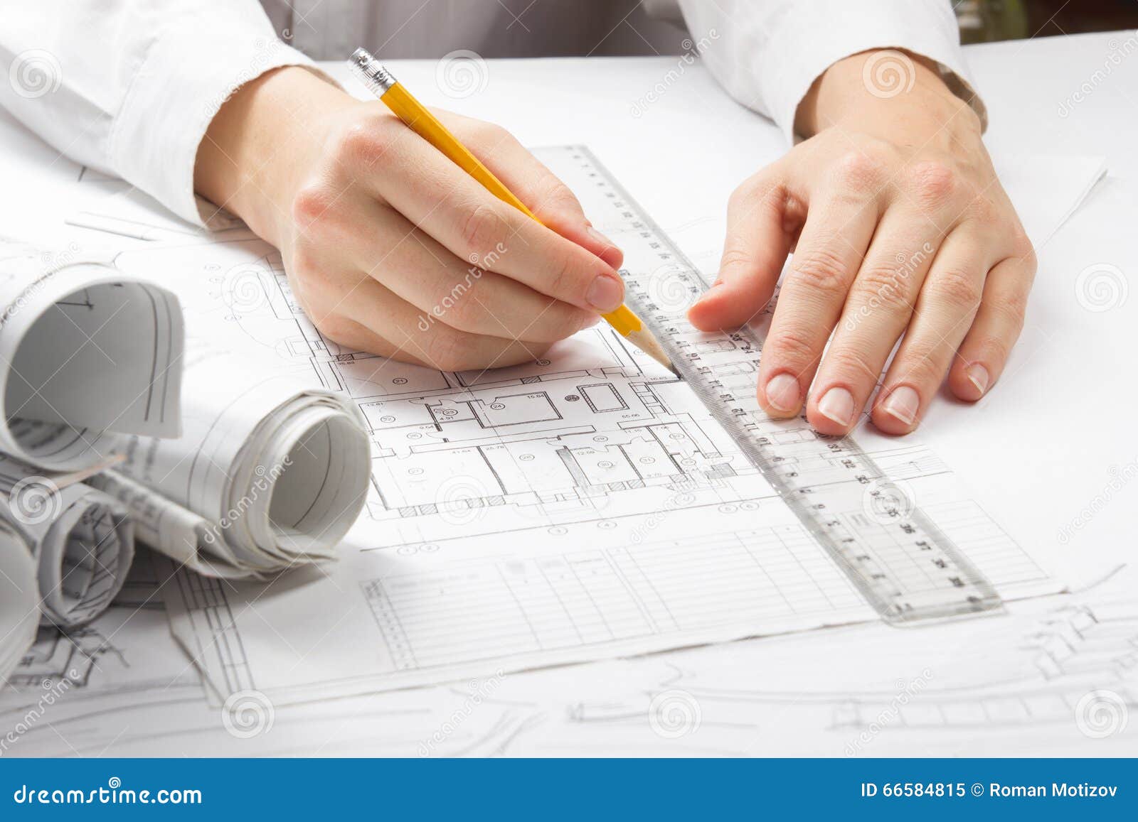 Architect Working On Blueprint. Architects Workplace - Architectural ...
