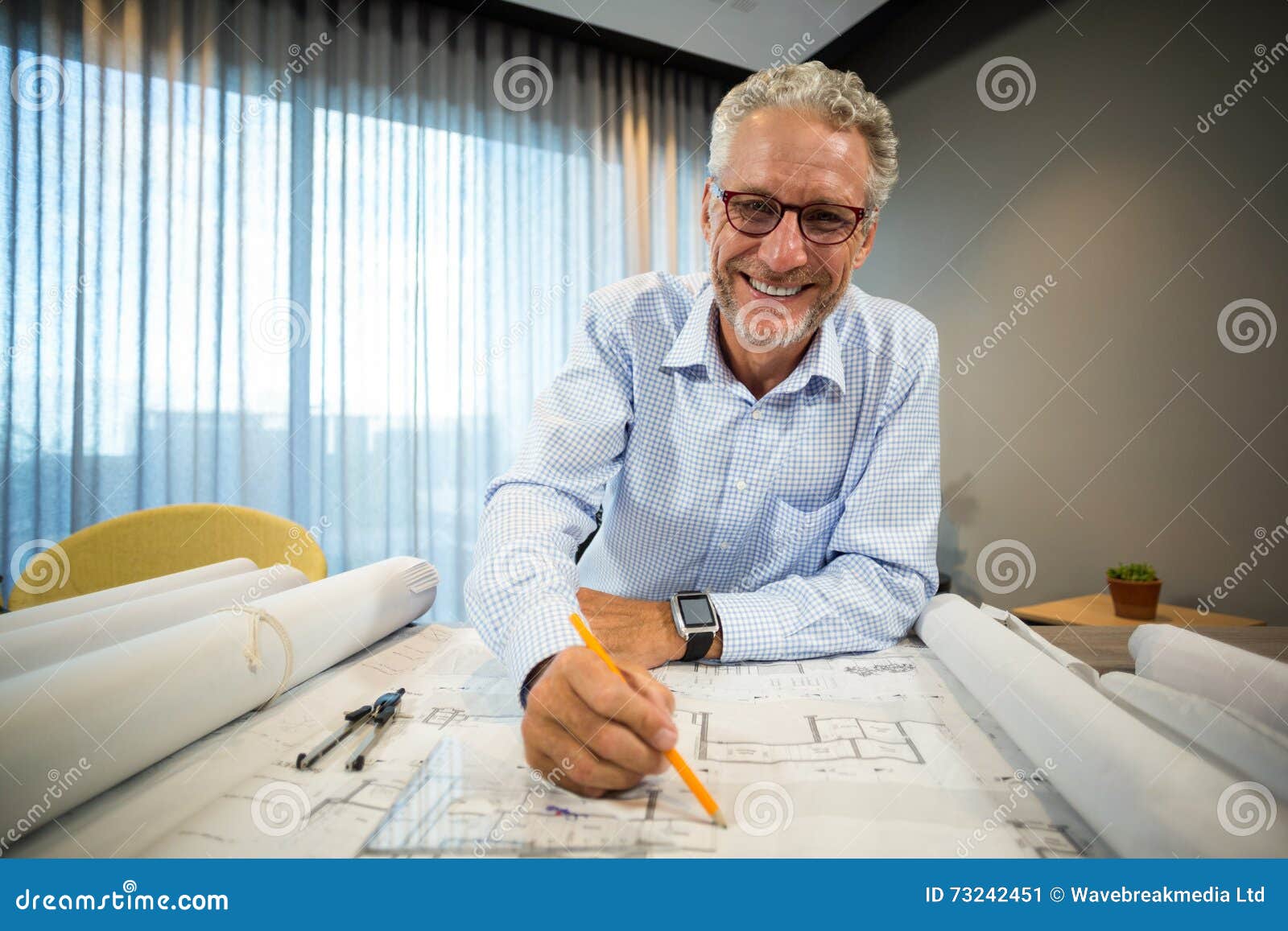 Architect Working on Blueprint at Desk Stock Image - Image of ...