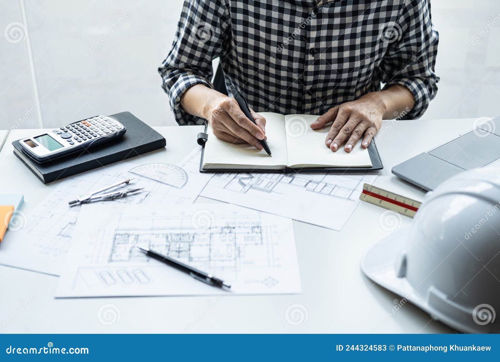 Architect Working on Blueprint, Engineer Working with Engineering Tools ...