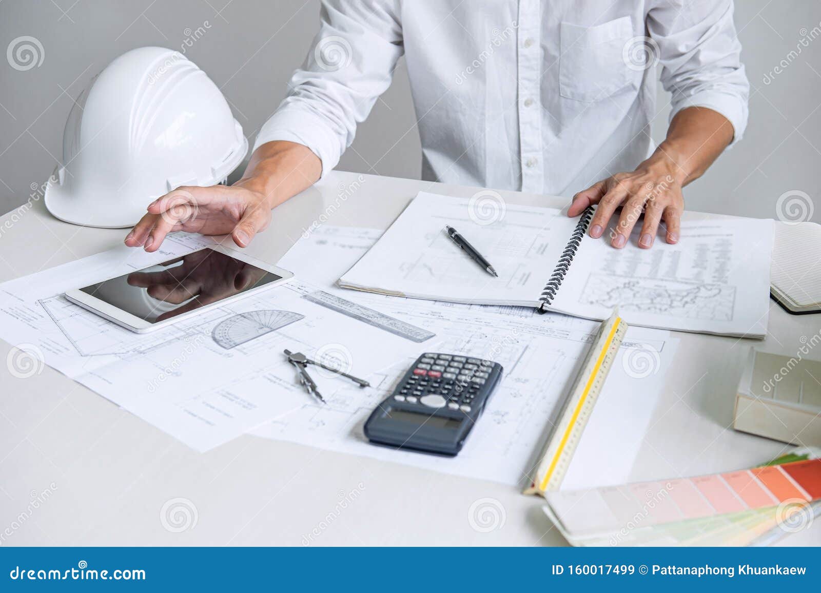 Architect Working on Blueprint, Engineer Working with Engineering Tools ...