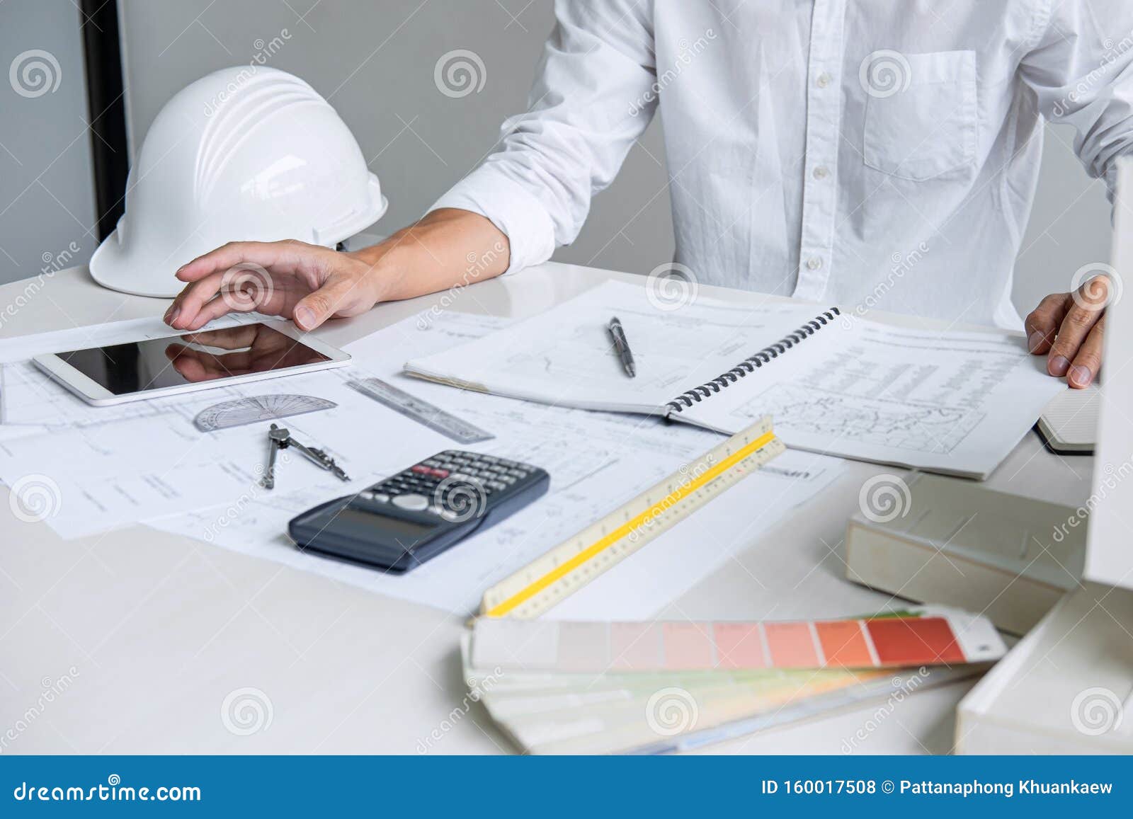 Architect Working on Blueprint, Engineer Working with Engineering Tools ...