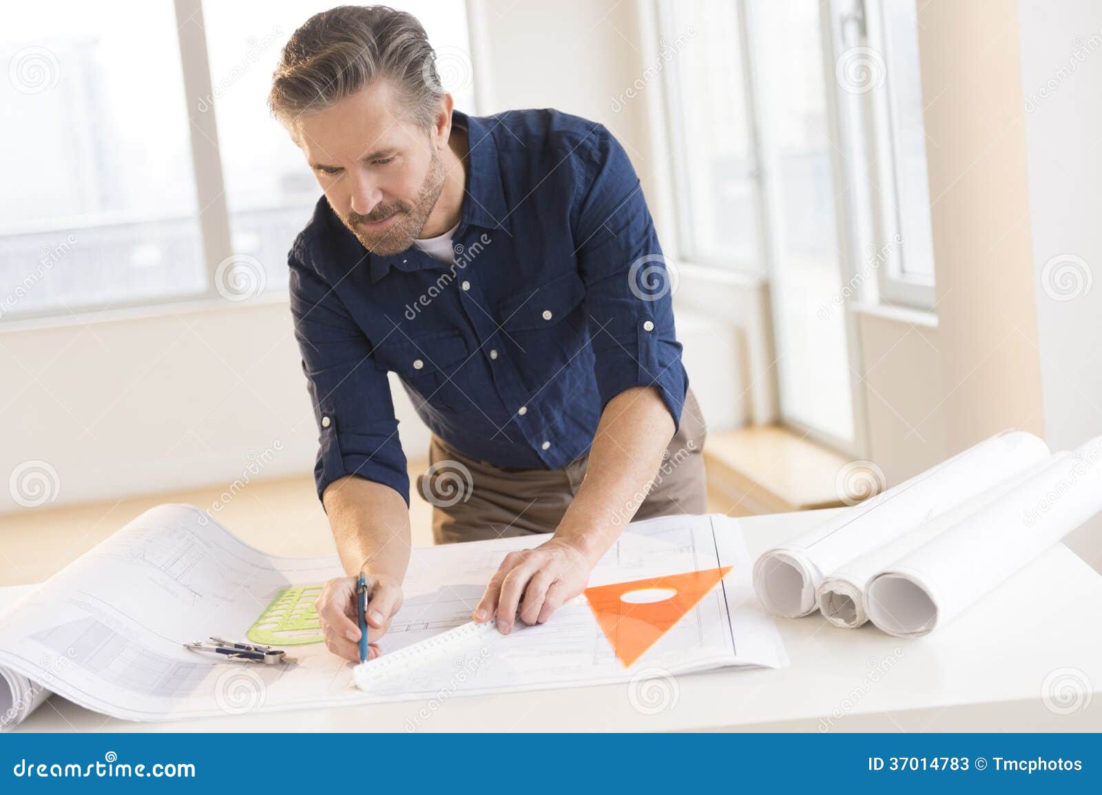 Architect Working on Blueprint at Office Desk Stock Image - Image of ...