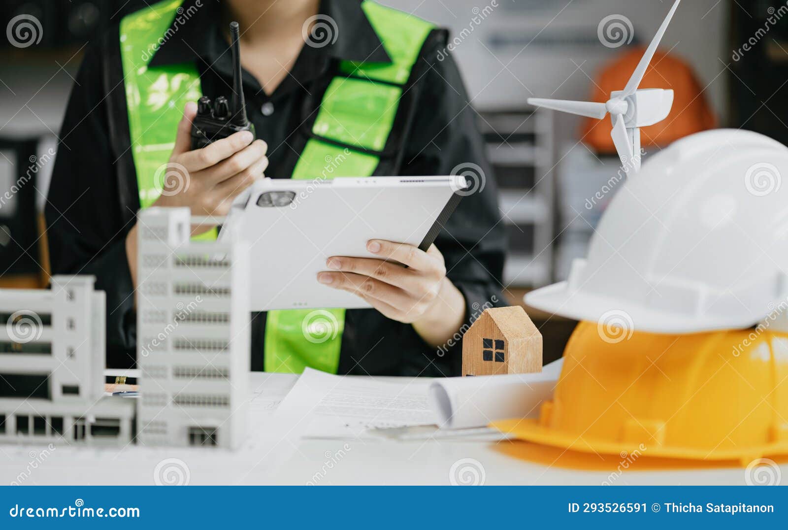 Architect Working with Blueprints for Sketching a Construction Project ...