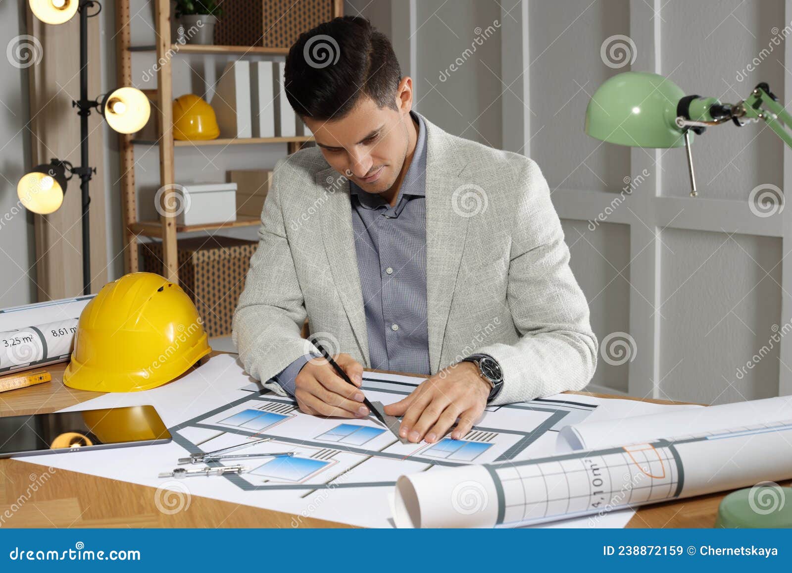 Architect Working with Construction Drawings in Office Stock Image ...