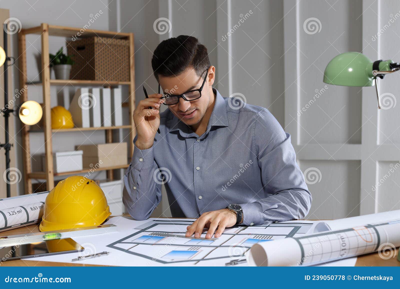 Architect Working with Construction Drawings in Office Stock Photo ...