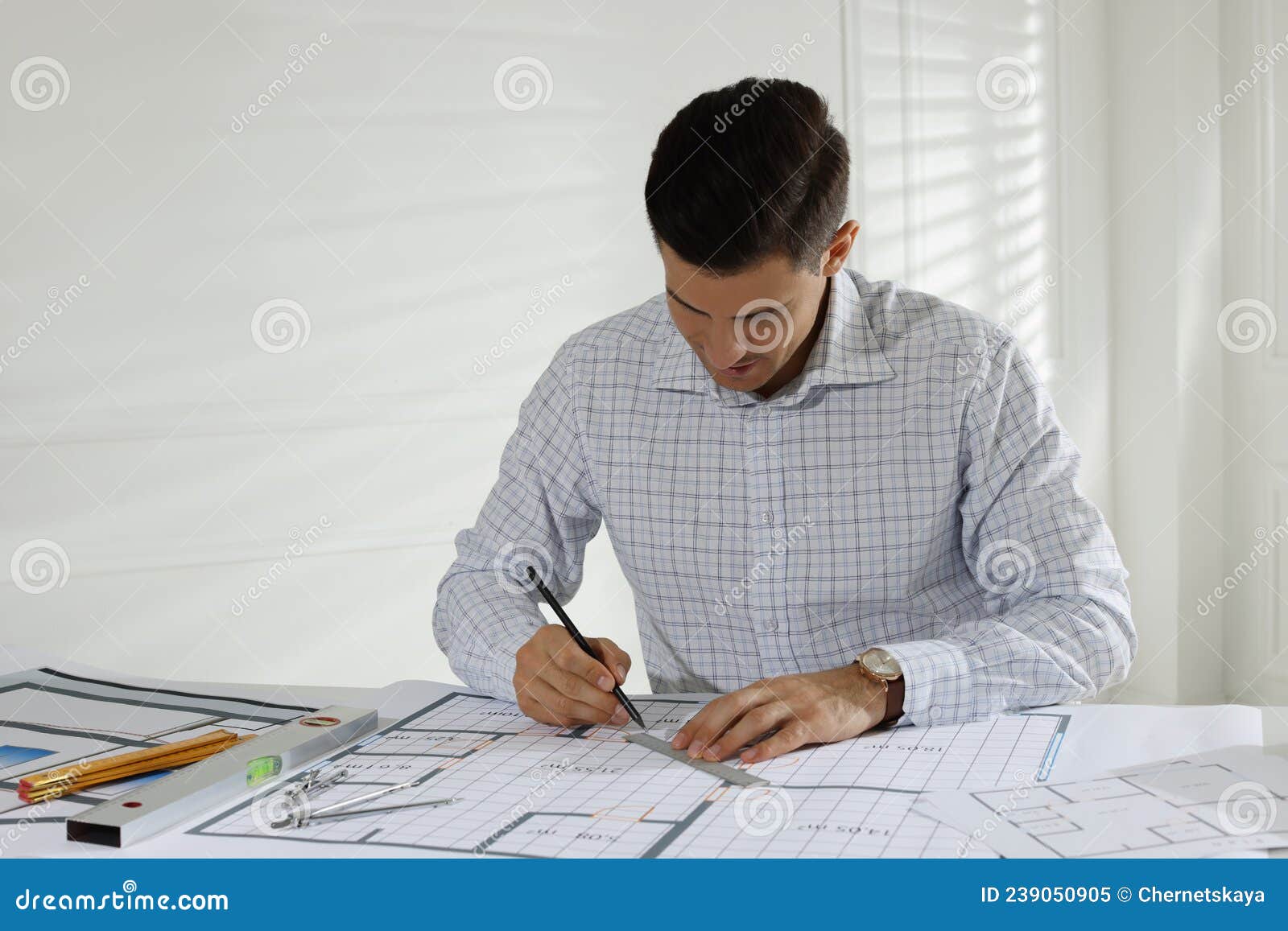 Architect Working with Construction Drawings in Office Stock Image ...