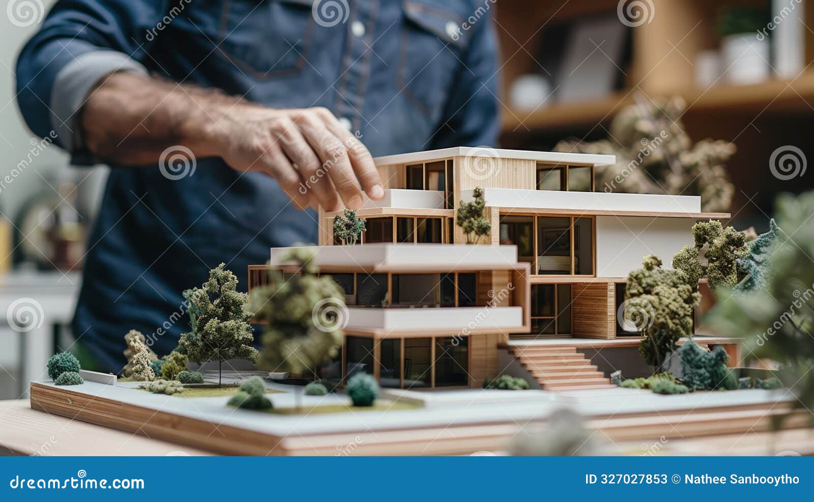 Architect Working on a Detailed Architectural Model of a Modern House ...