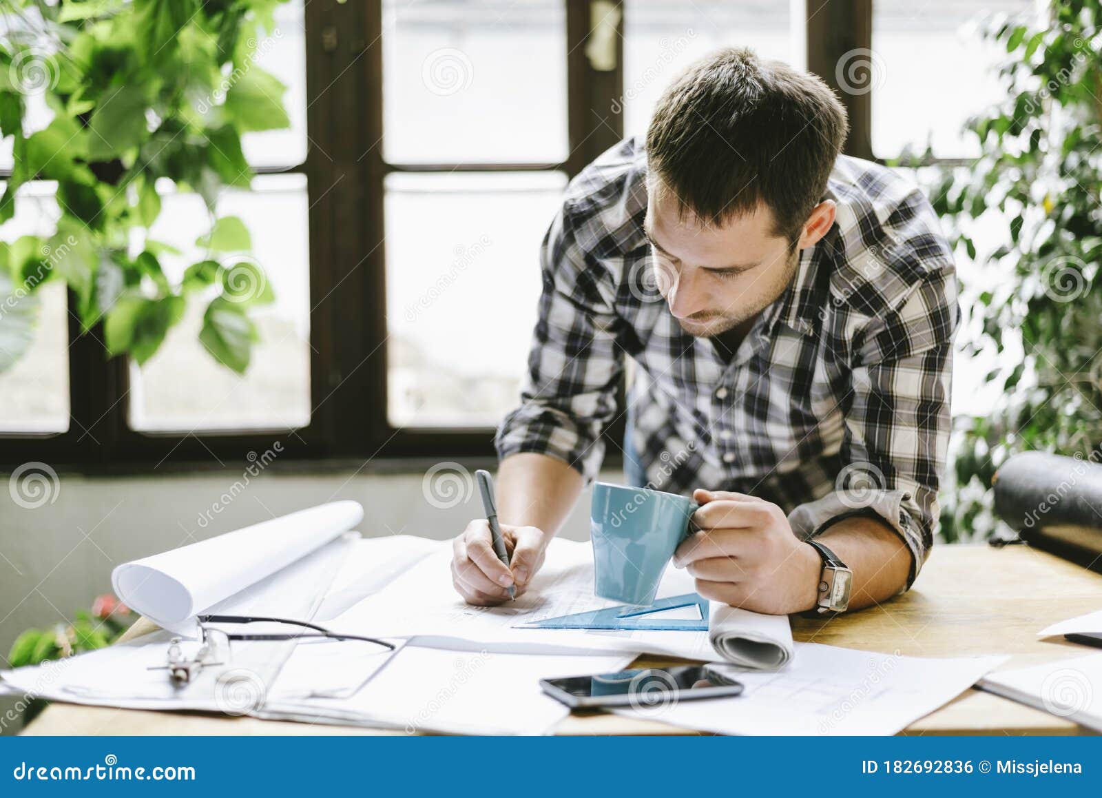 Architect Working on Freelance Renovation Project in His Cool Home ...