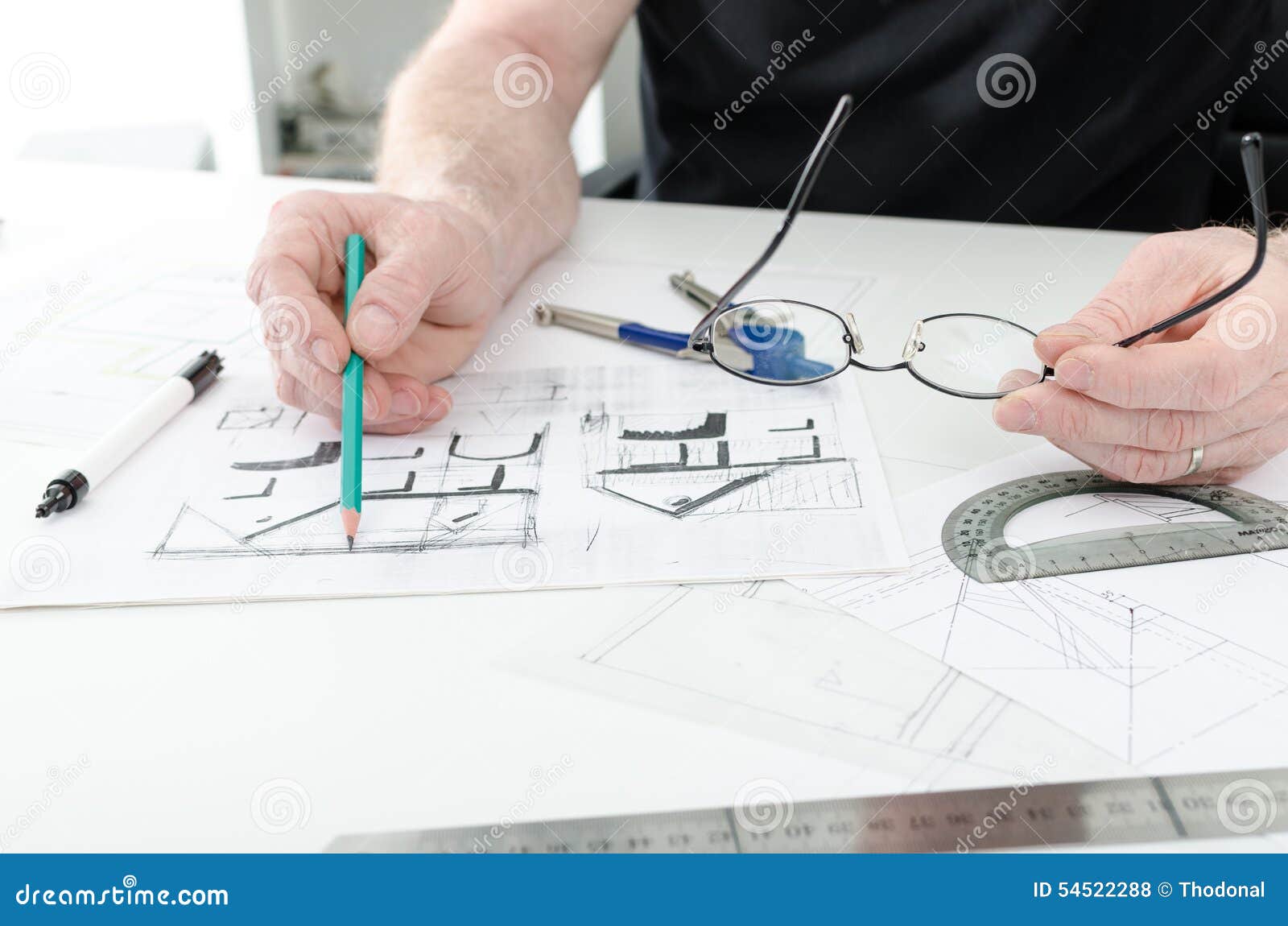 Architect working on plans stock photo. Image of architecture - 54522288
