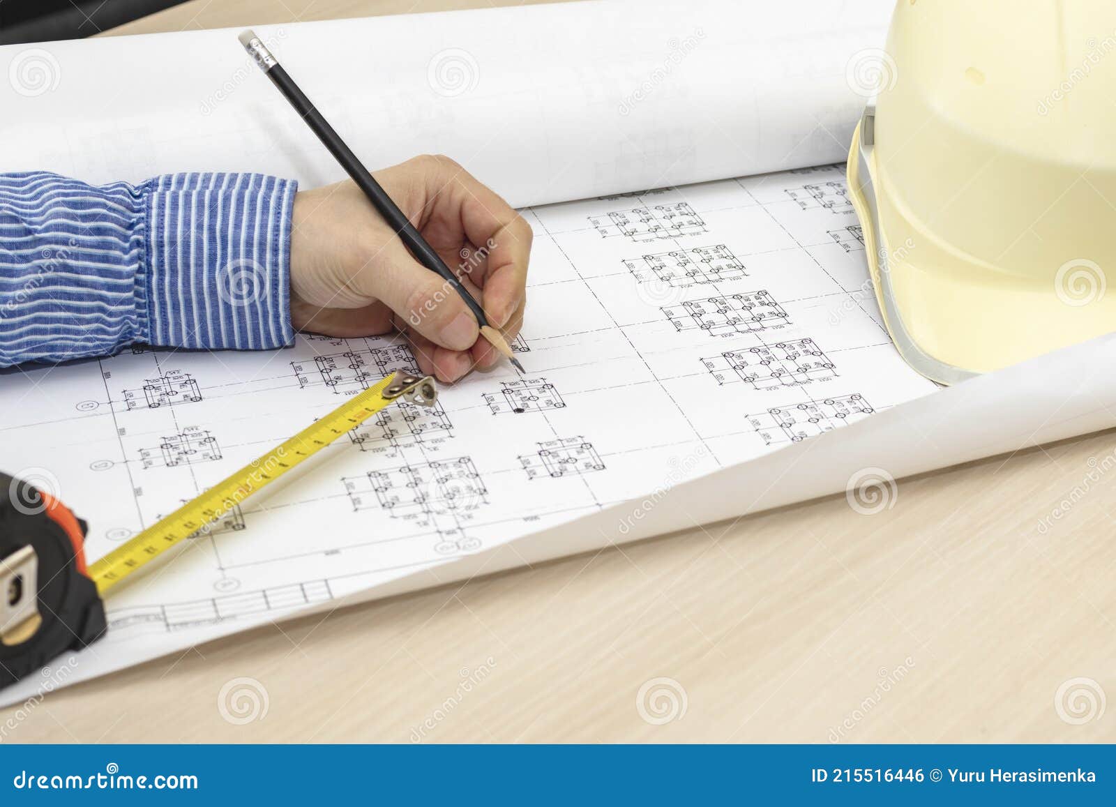 An Architect is Working with a Project. Making Changes To Construction ...