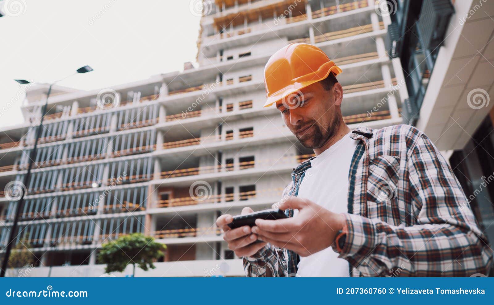 Architect Working with Smartphone on Construction Site. Engineer Check ...