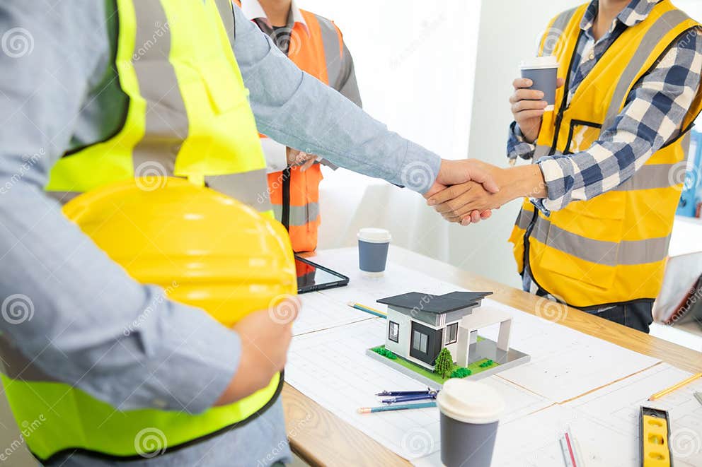 Architects and Construction Engineering Handshake after Meeting Discuss Structural Blueprints ...