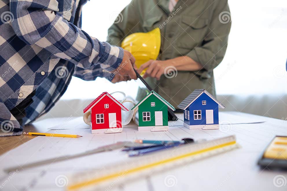 Architects and Construction Engineers Meet To Discuss Blueprints of ...