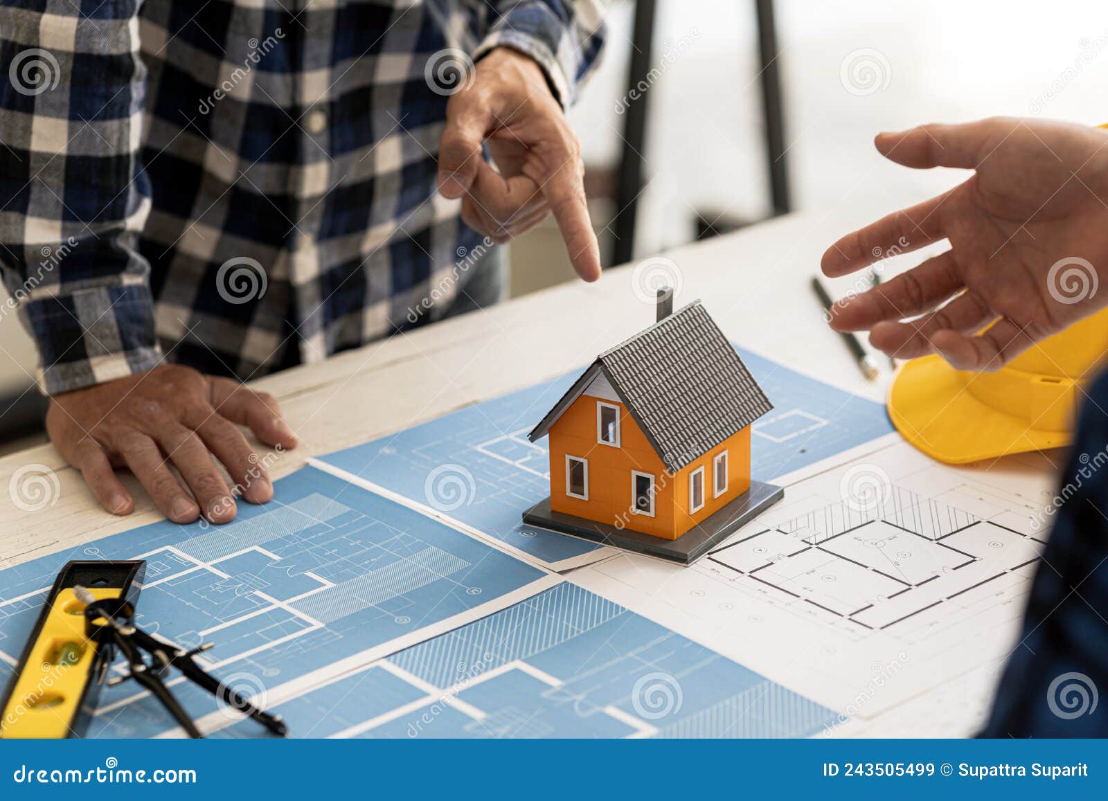 Architects Design Team is Looking at Models of Small Houses, Architect ...